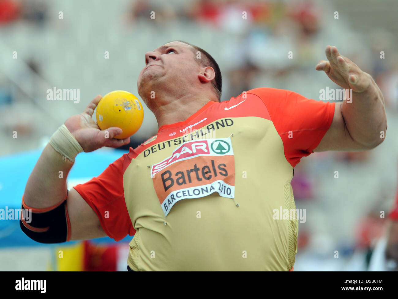 German shot putter Ralf Bartels throws at the Olympic stadium Lluis ...