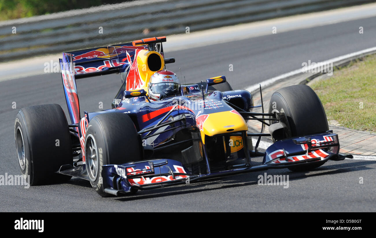 German driver Sebastian Vettel of Team Red Bull drives through a turn ...