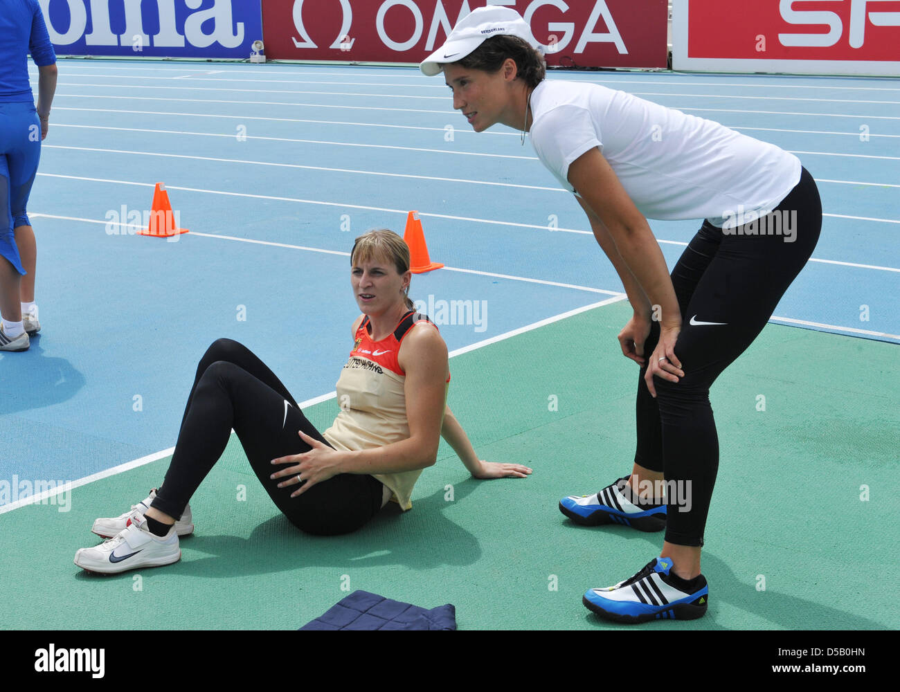 German heptathletes Maren Schwerdtner (R) and Claudia Roth chat during ...