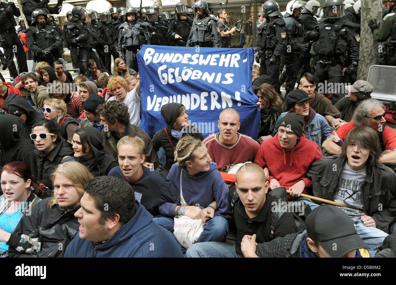 Protestors rally against some 650 German Bundeswehr recruits takling ...