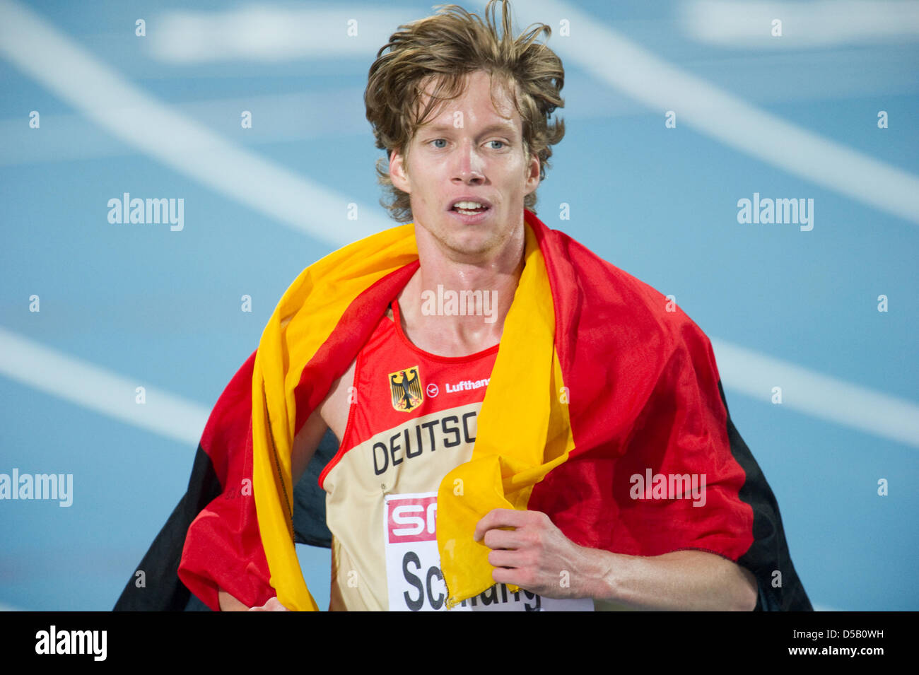 German runner Carsten Schlangen celebrates his second place in the ...