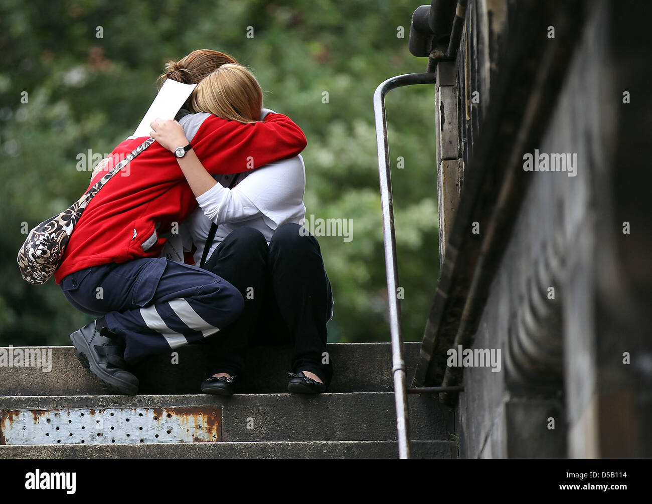 Two crying rescue workers, who have left the church during the memorial ...