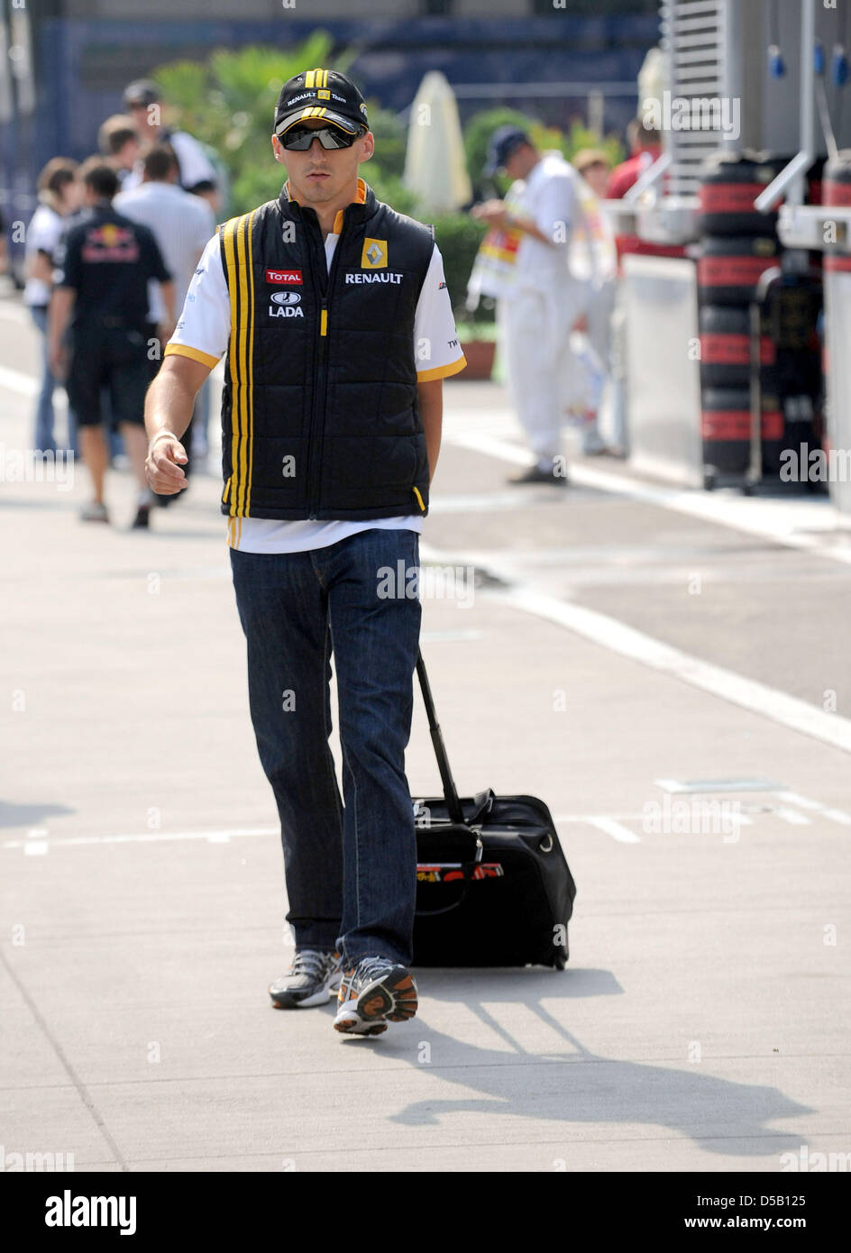 Polish race driver Robert Kubica of Renault of Team Red Bull walks ...