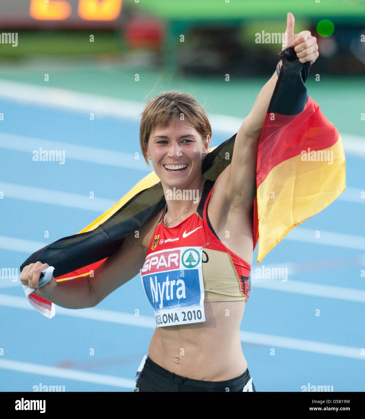 The German hurdler Carolin Nytra celebrates her bronze medal at the ...