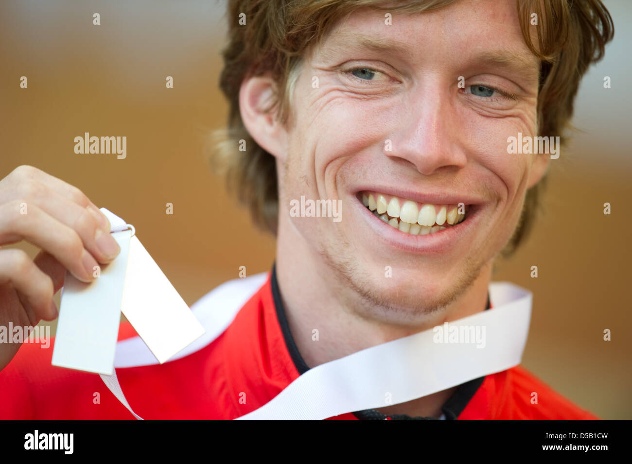 German long distance runner Carsten Schlangen poses with his silver ...