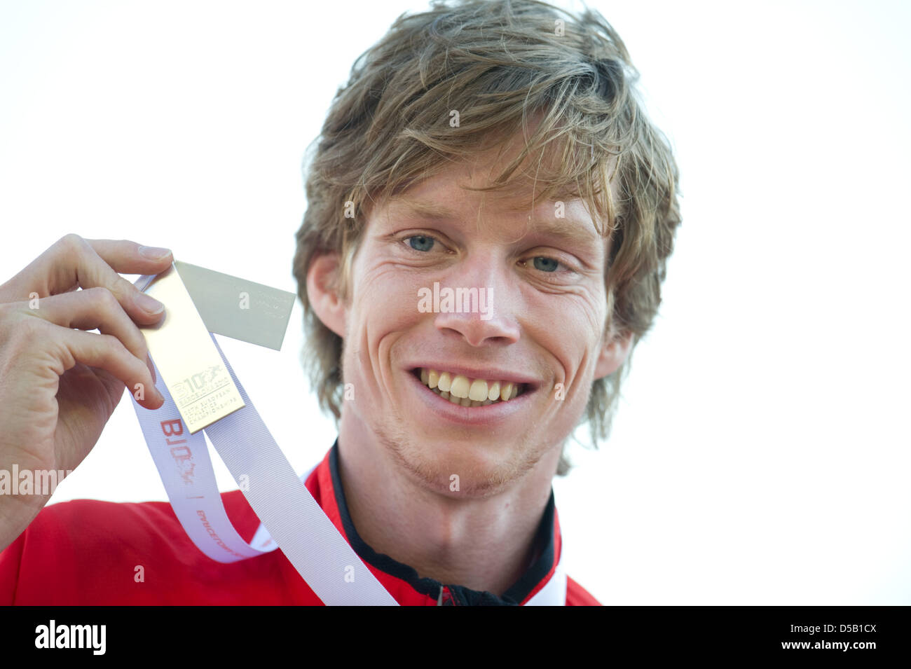 German long distance runner Carsten Schlangen poses with his silver ...
