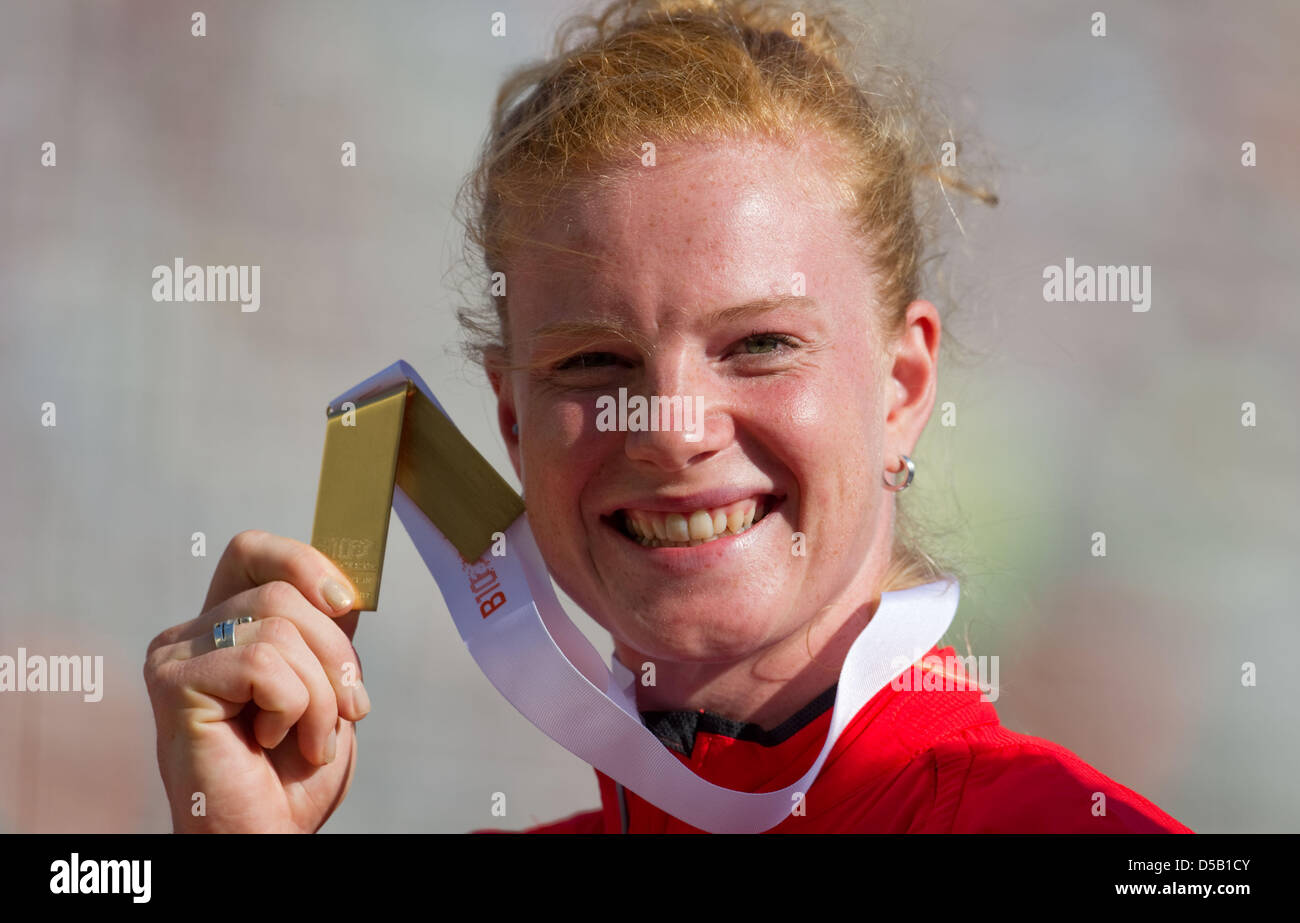 German hammer thrower Betty Heidler poses with her gold medal during ...