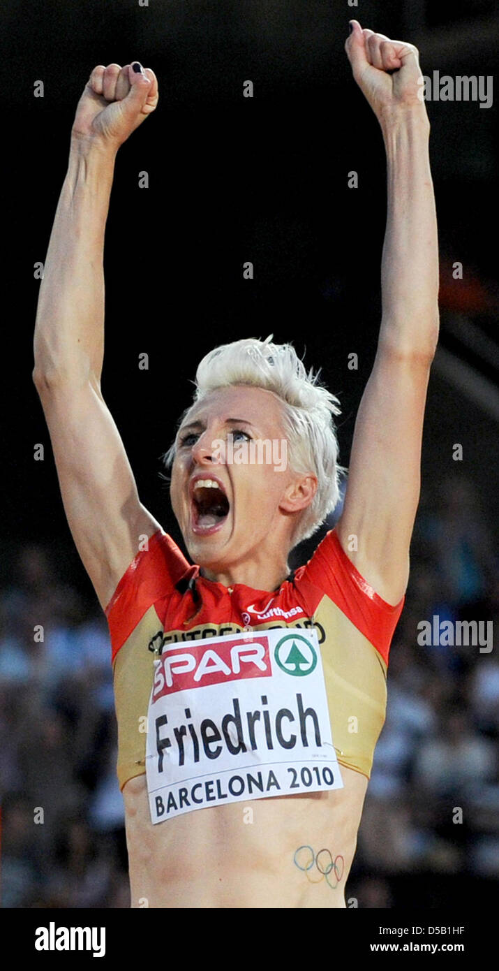 German high jumper Ariane Friedrich leaps up in joy after winning the ...