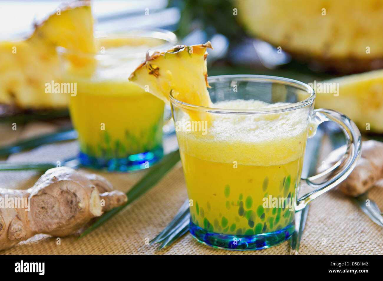 Fresh Pineapple with ginger juice Stock Photo - Alamy