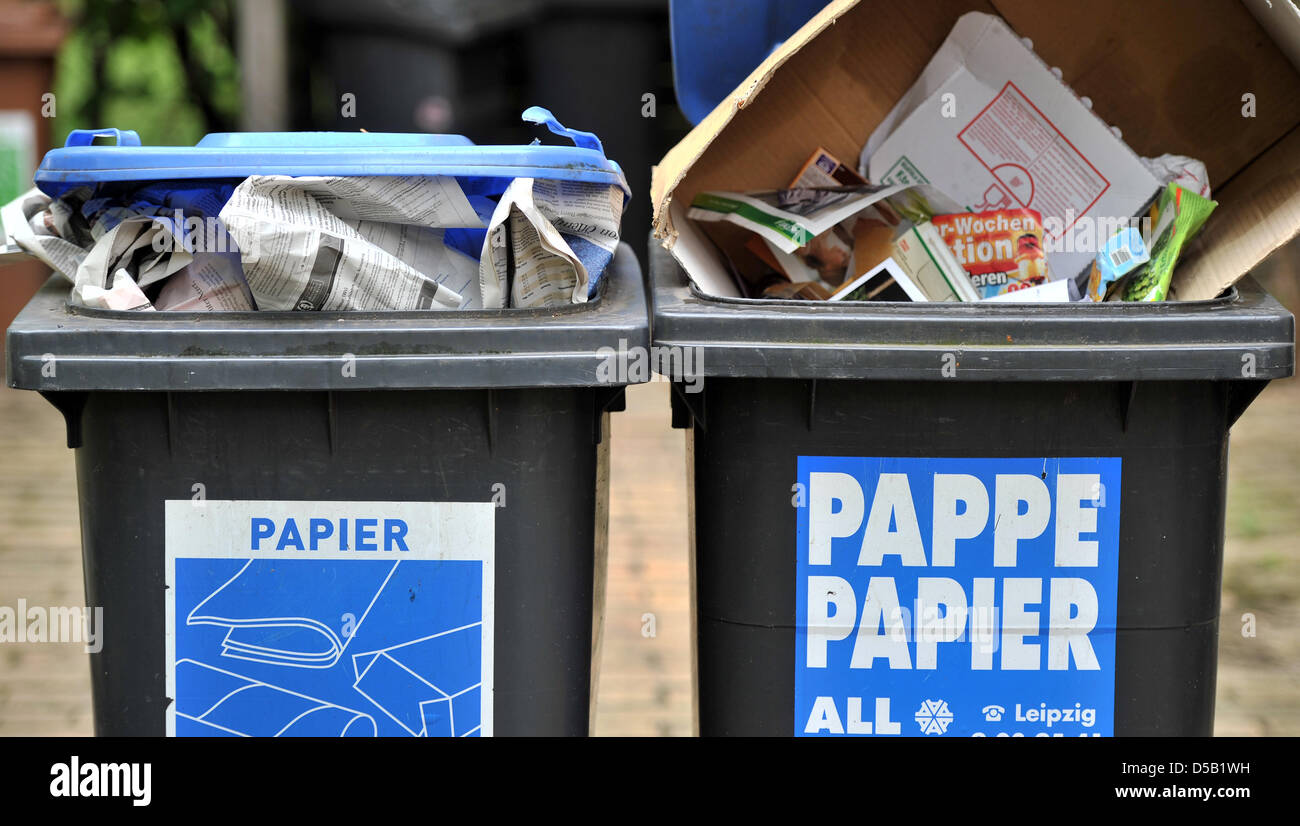 Paper recycling bins stand in a backyard in Leipzig, Germany, 2 August ...