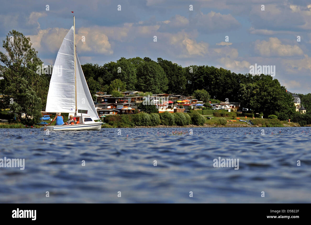 Visitors of the reservoir Pirk cross the 'Voigtland Sea' with their ...