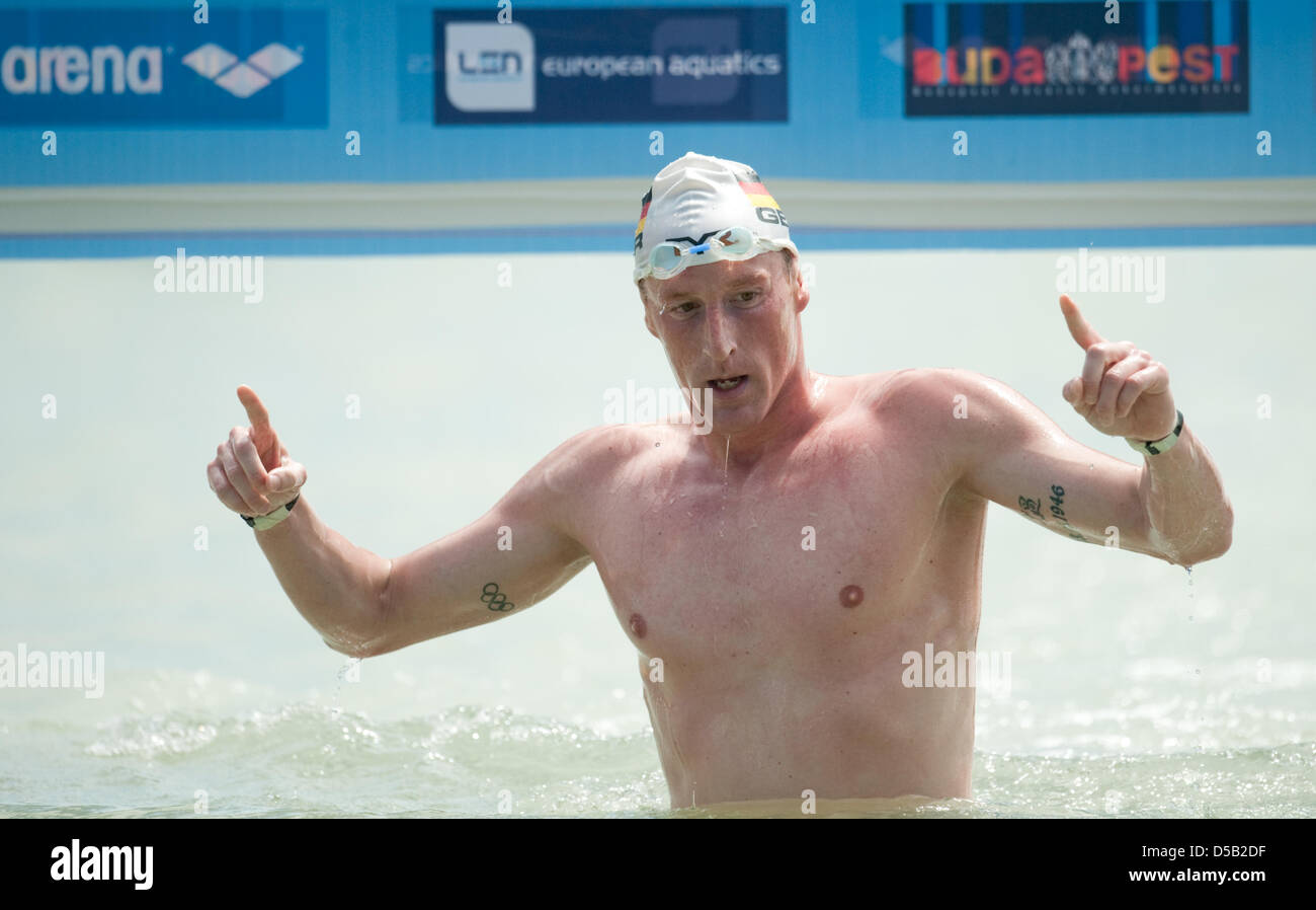 German swimmer Thomas Lurz celebrates his victory at the goal during ...