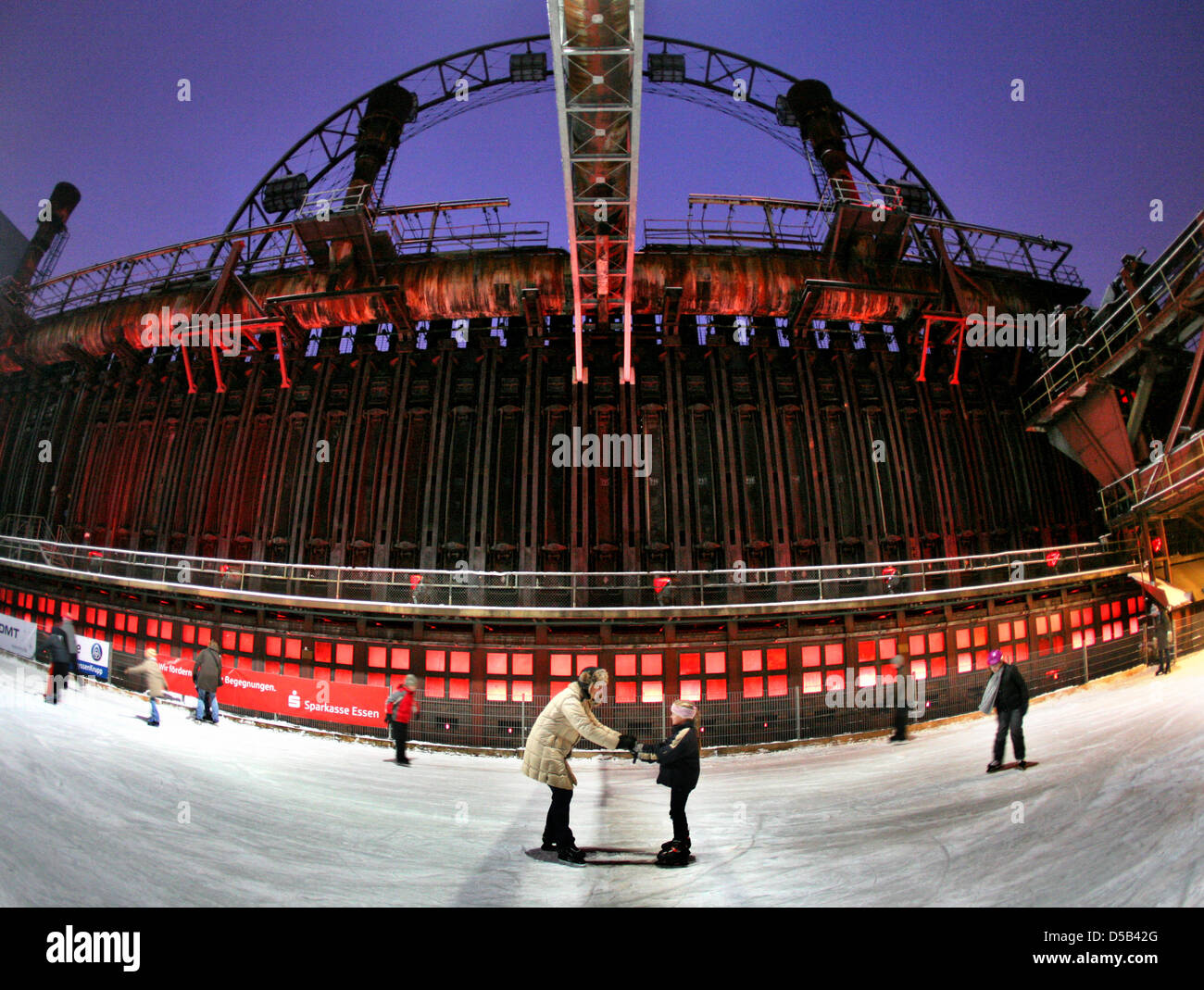 A woman and a child skate on the ice skating rink Kokerei tariff union ...
