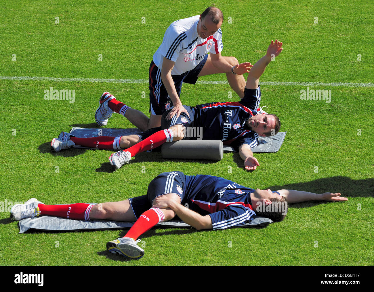 German Bundesliga FC Bayern Munich's Franck Ribery (C) is treated ...