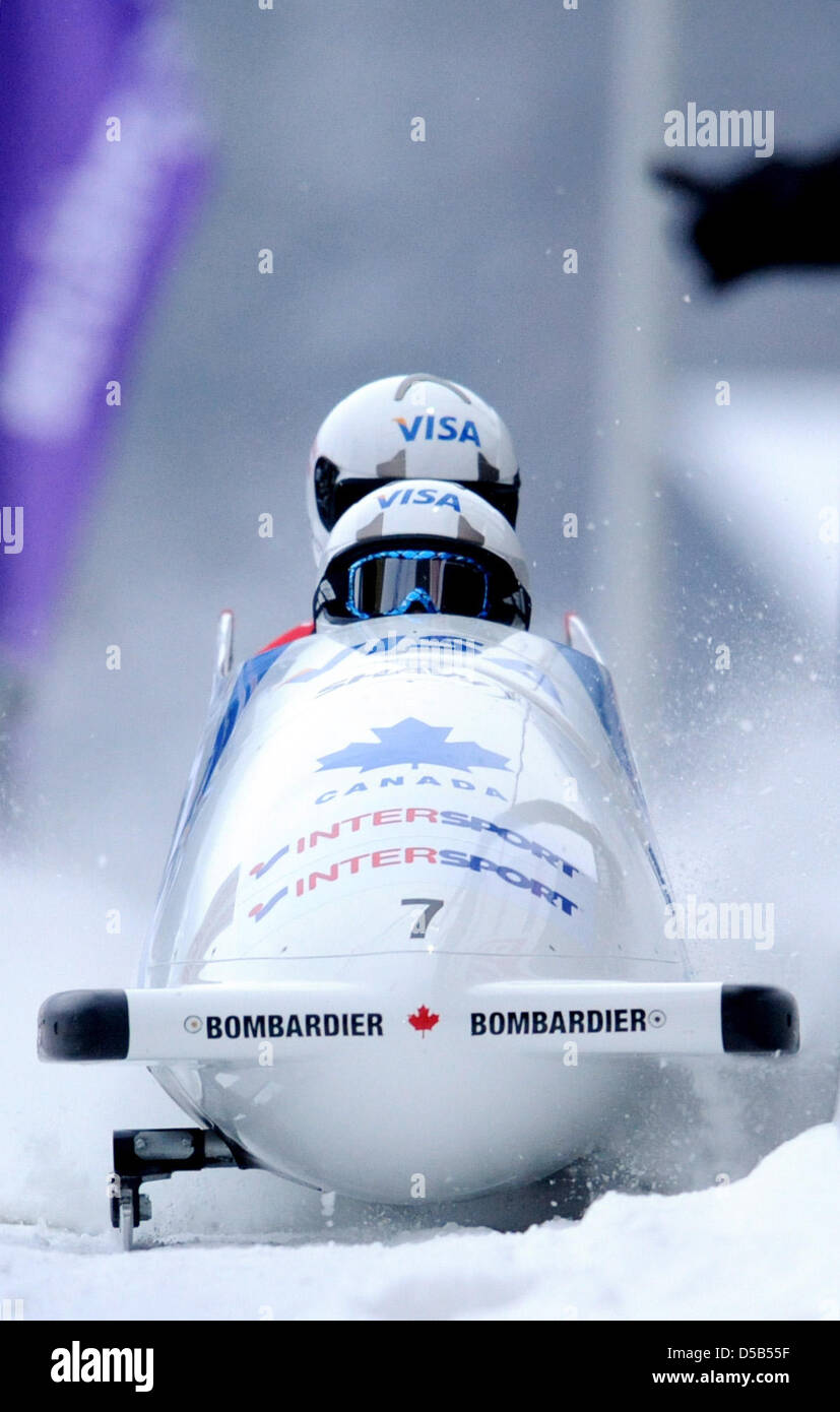 Kaillie Humphries (front) and Heather Moyse of team Canada 1 speed down ...