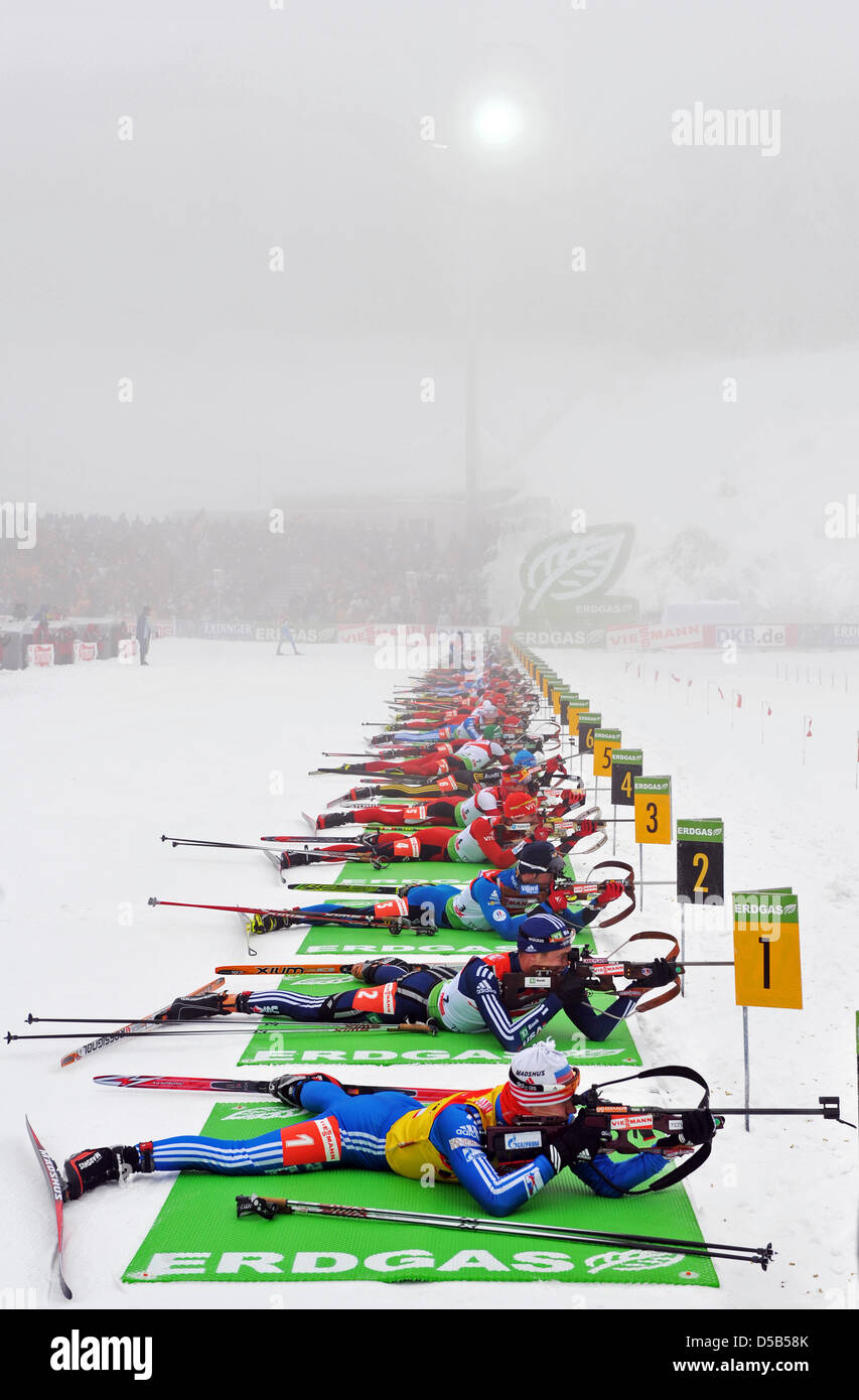 The biathletes lay at the shooting range during the men's mass start ...
