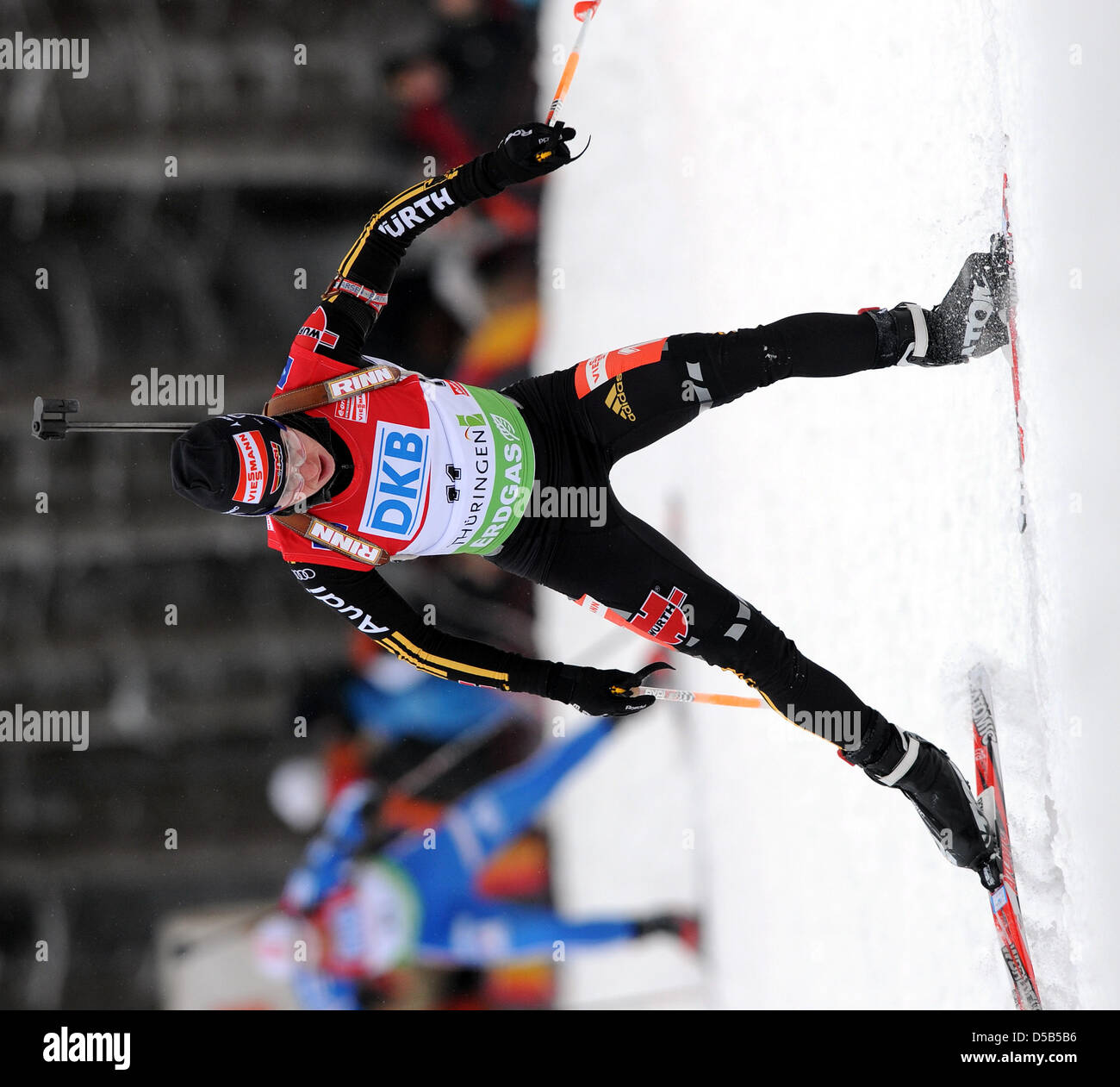 German Biathlete Andrea Henkel stuggles with a raise in Ski-stadium ...
