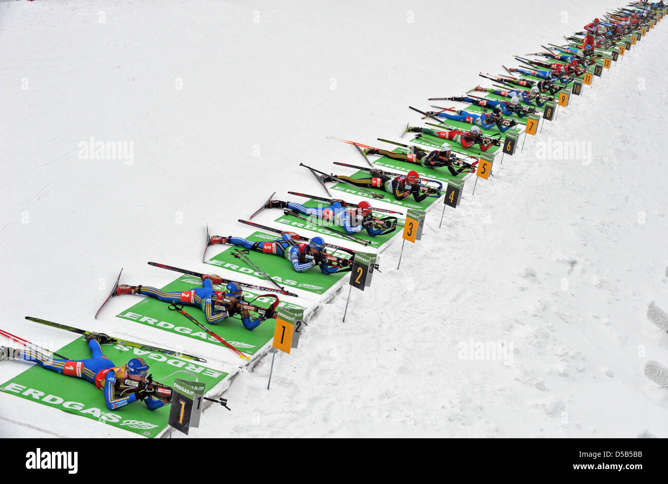 Thirty Biathletes lay at the shooting range during the during the mass ...