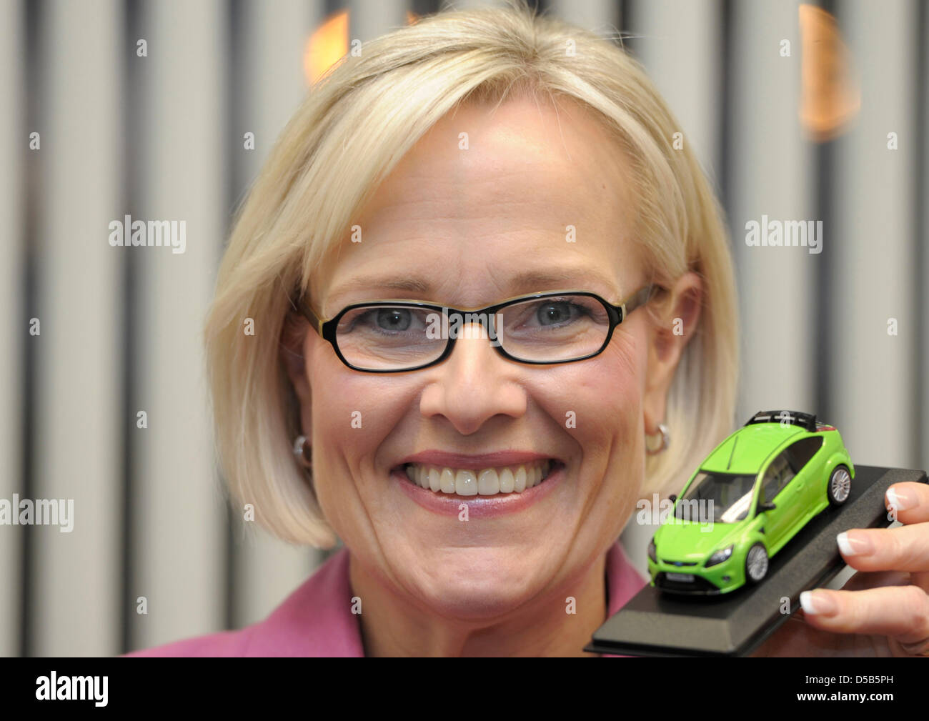 Birgit Behrendt holds a model car in her hand at the Ford factory in ...