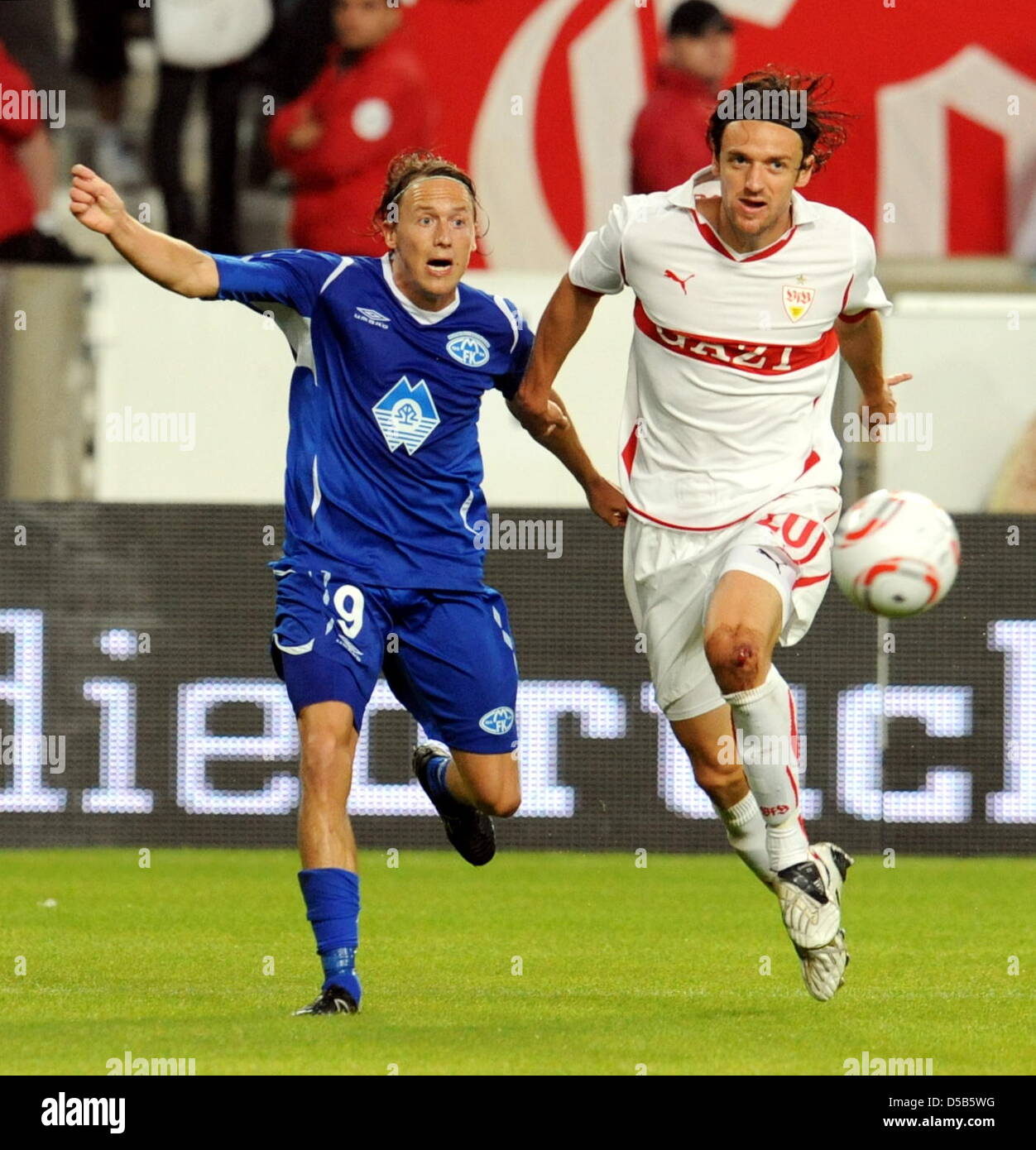 Stuttgart's Christian Gentner (R) and Molde's Mattias Mostrom vie for ...