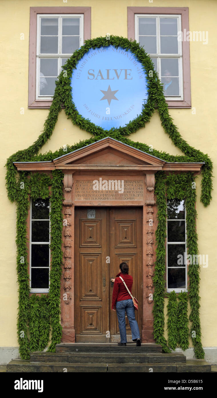 A visitor enters the decorated front gate of the Goethe National Museum ...