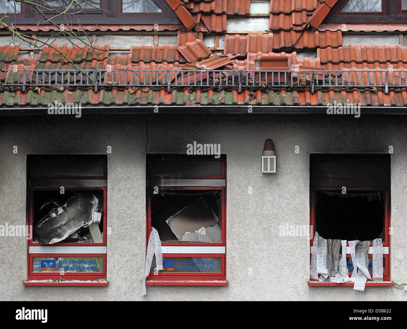 The wall above the blown-out windows has been blackened by soot after a ...