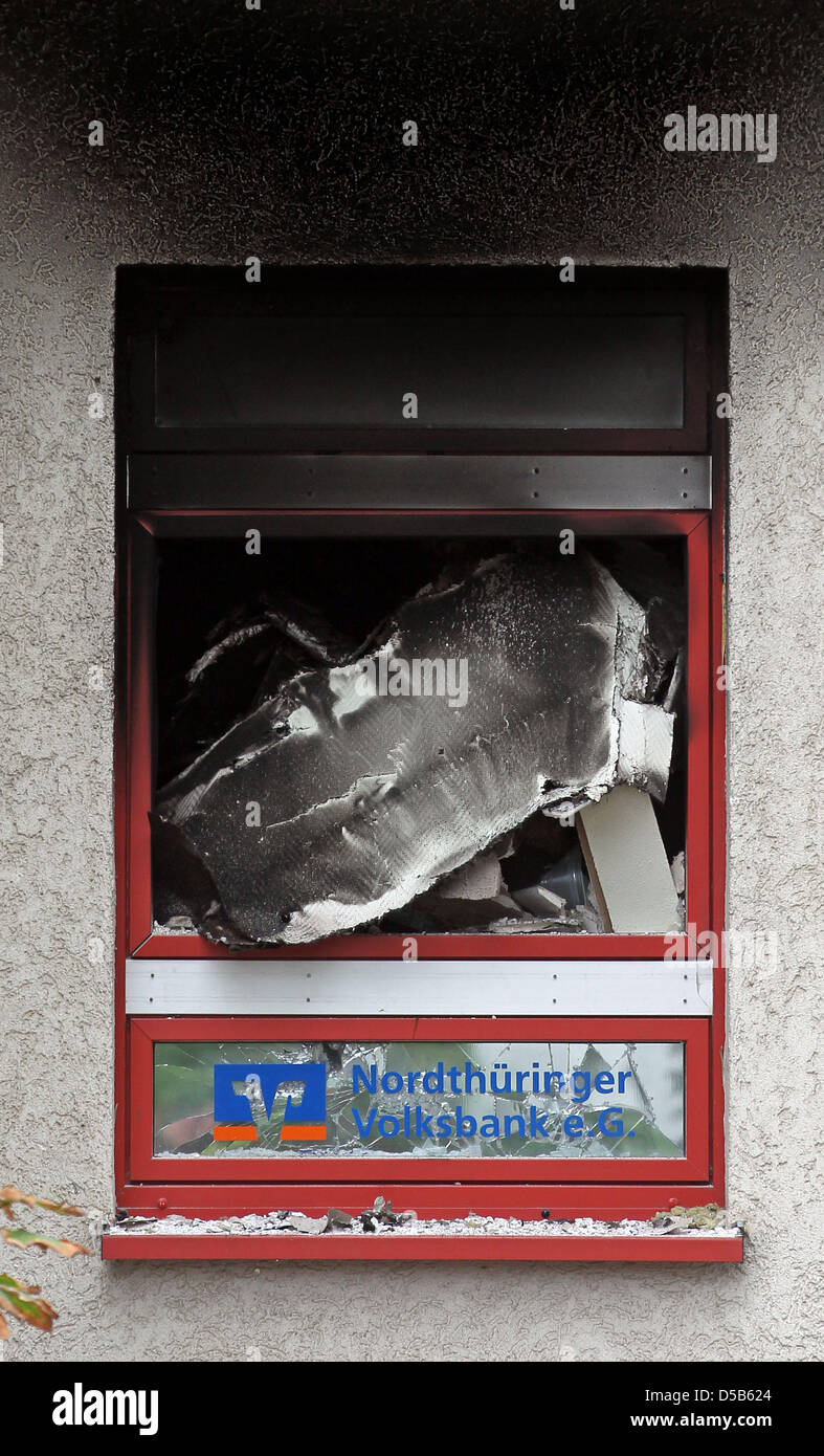 The wall above the blown-out window has been blackened by soot after a ...