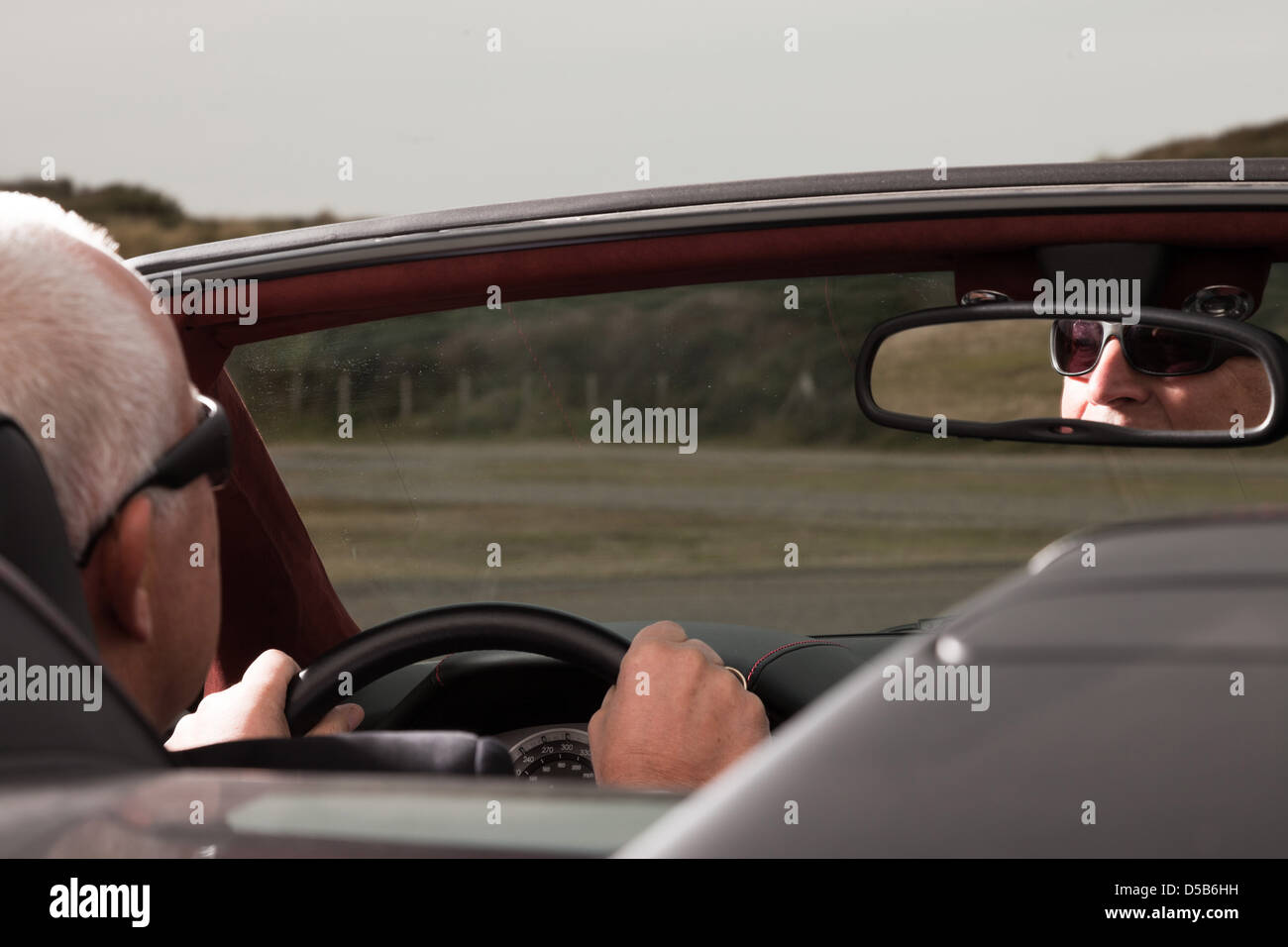 Happy retired man with sunglasses driving in his sports car Stock Photo ...