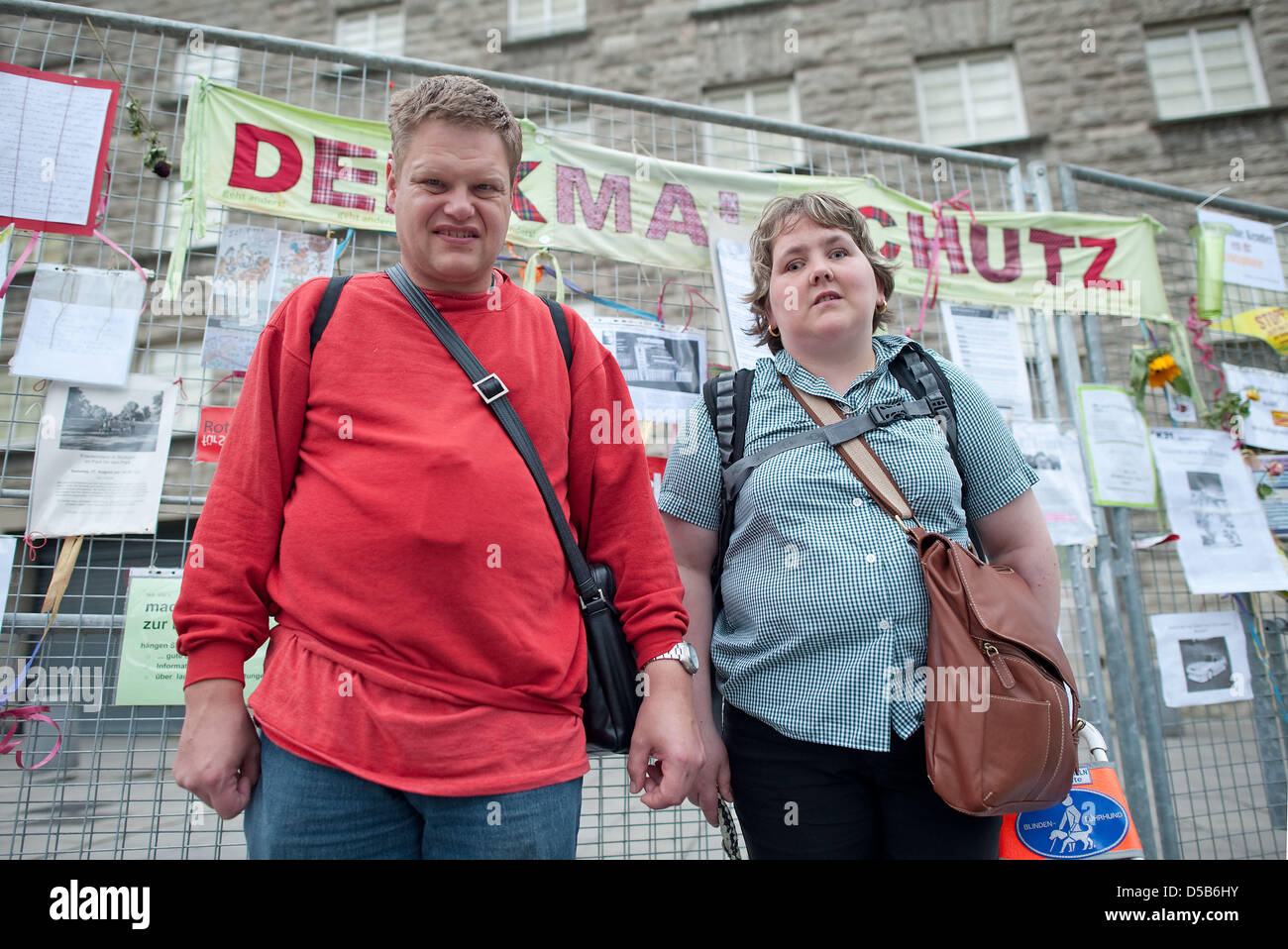 Visually impaired couple Nicole and Roland Doehring stand in front of a ...