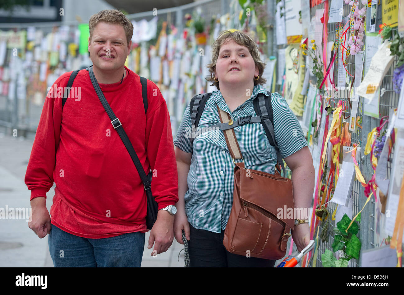 Visually impaired couple Nicole and Roland Doehring stand in front of a ...