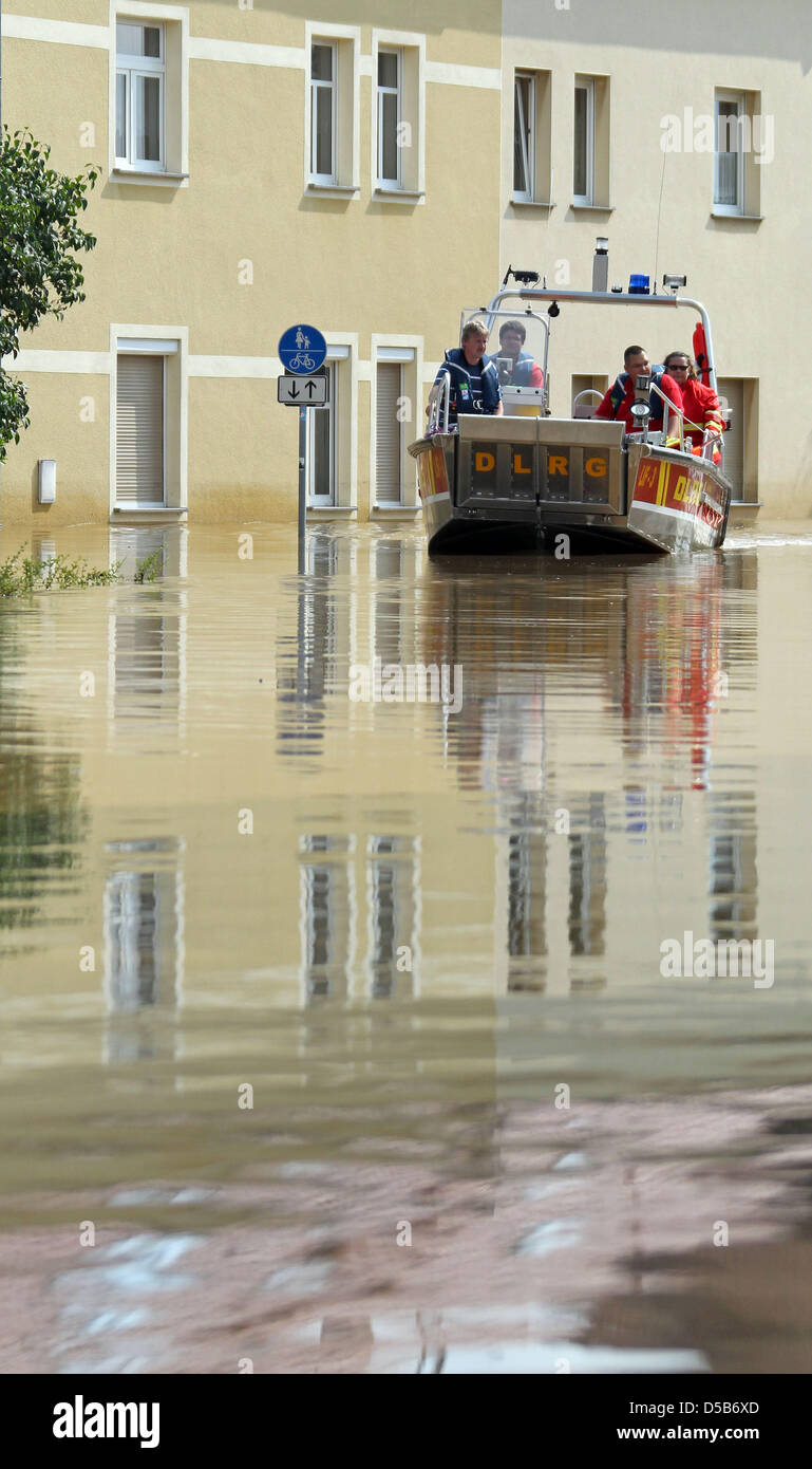 A German Lifeguard Association (DLRG) boat passes through the flooded ...
