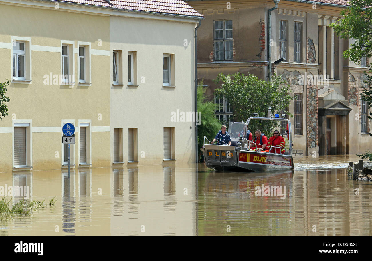 A German Lifeguard Association (DLRG) boat passes through the flooded ...