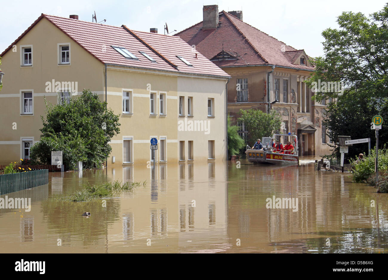 A German Lifeguard Association (DLRG) boat passes through the flooded ...