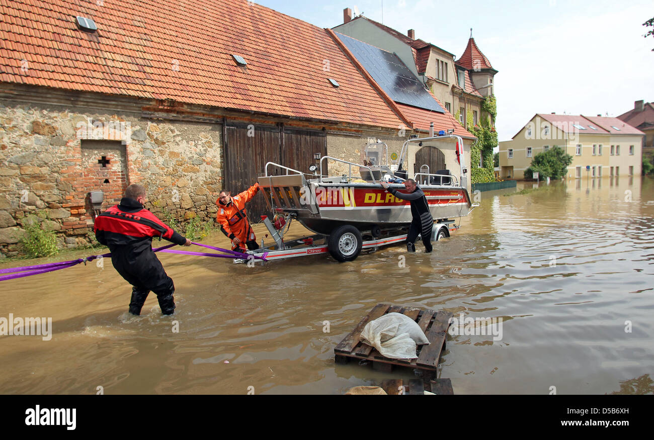 A German Lifeguard Association (DLRG) boat passes through the flooded ...
