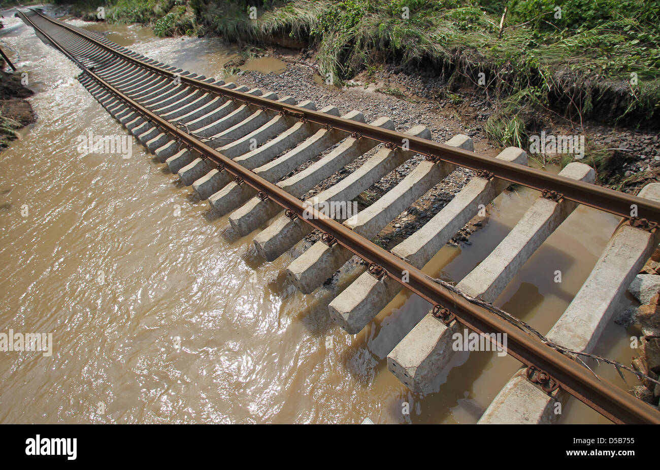Railway track have been washed out by high water in the flooded town of ...