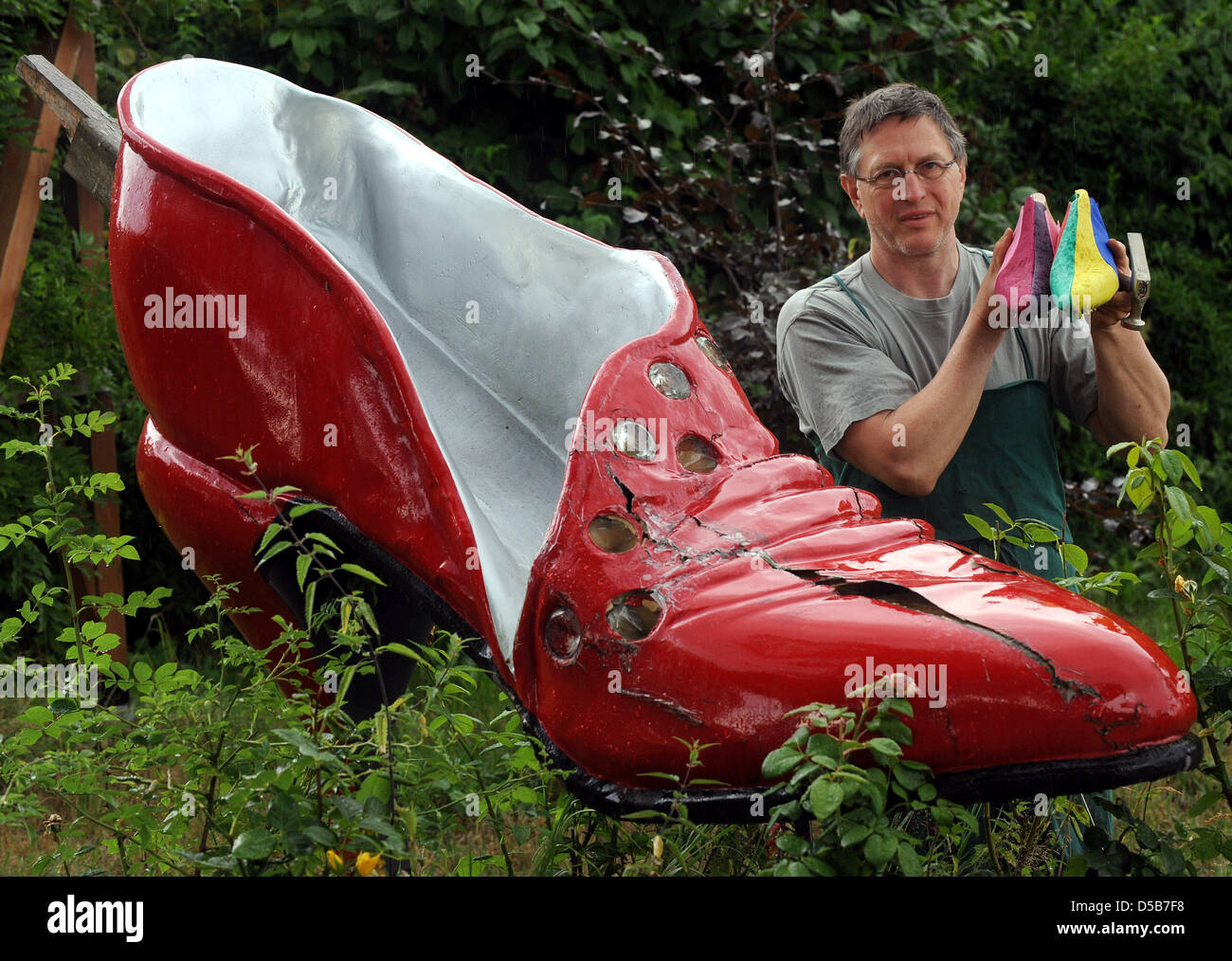 Shoemaker Andreas Frank presents a self-made oversize lady's shoe out ...