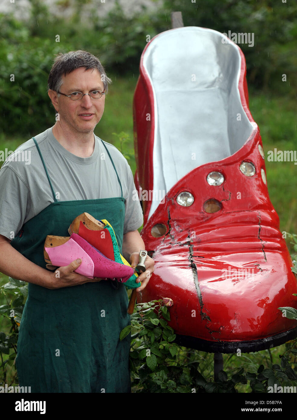 Shoemaker Andreas Frank presents a self-made oversize lady's shoe out ...