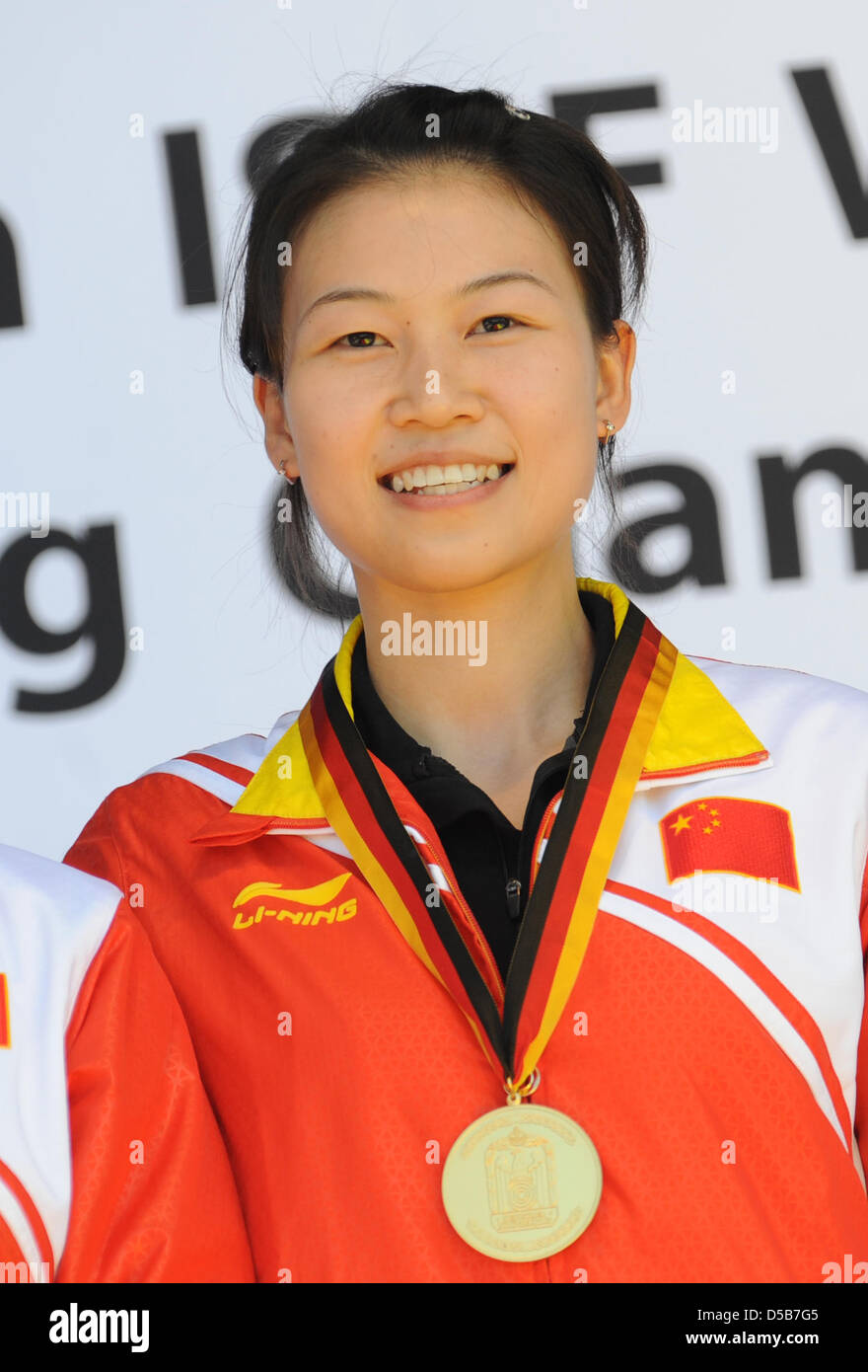 Chinese gold medalist Siling Li smiles with her medal after the 10m Air ...