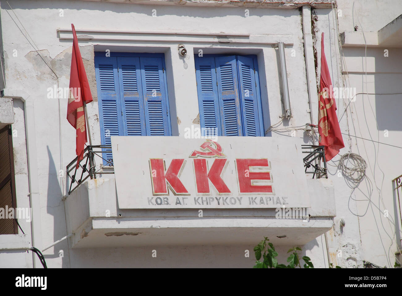 Red flags and the logo of the Commmunist Party of Greece (KKE) adorn ...