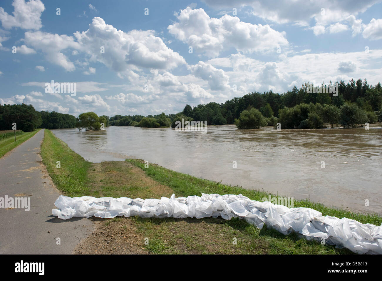 Unusually wide is the river Nysa, due to flood waters, between ...
