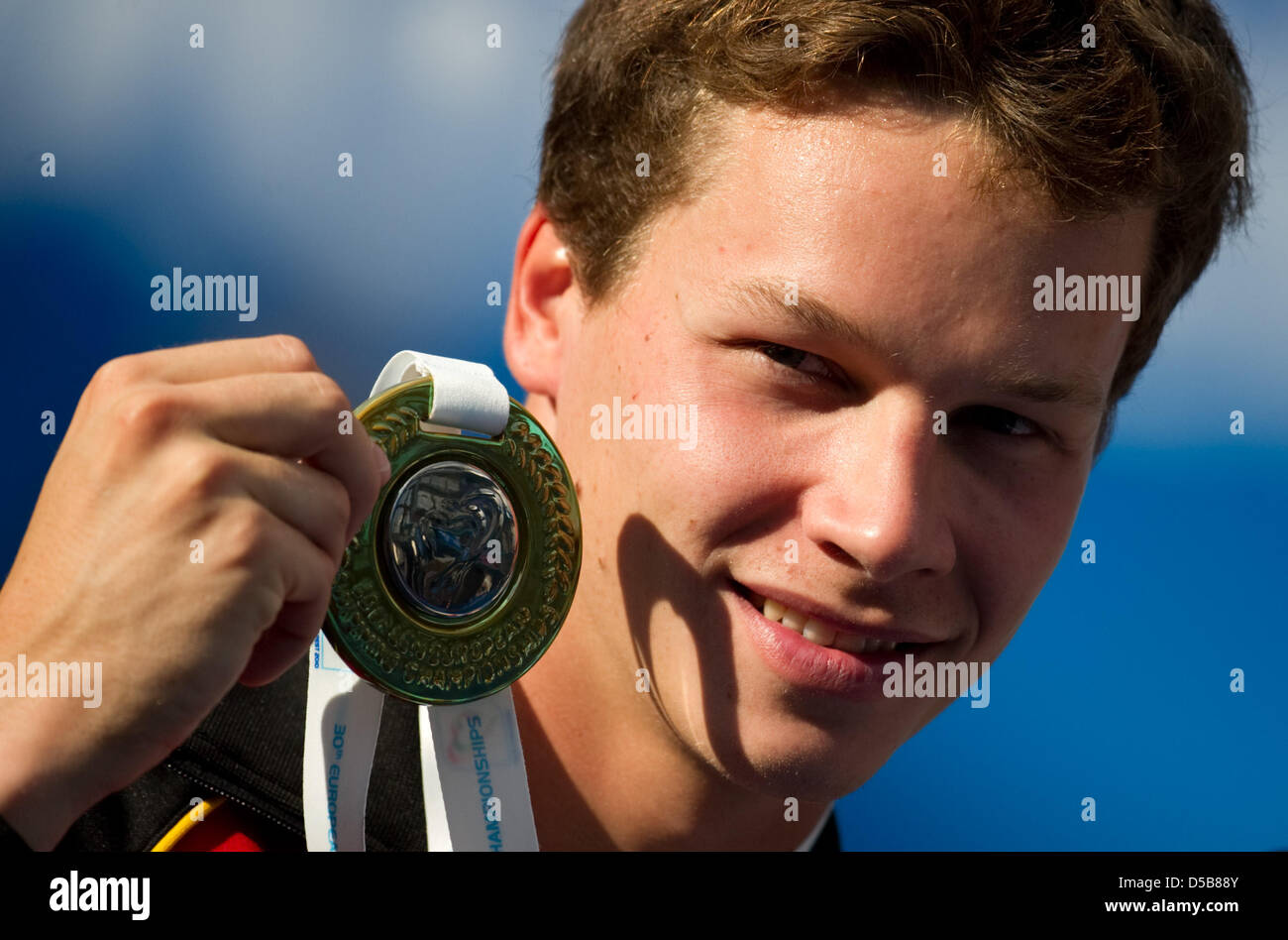 German high diver Patrick Hausding shows his silver medal for high ...