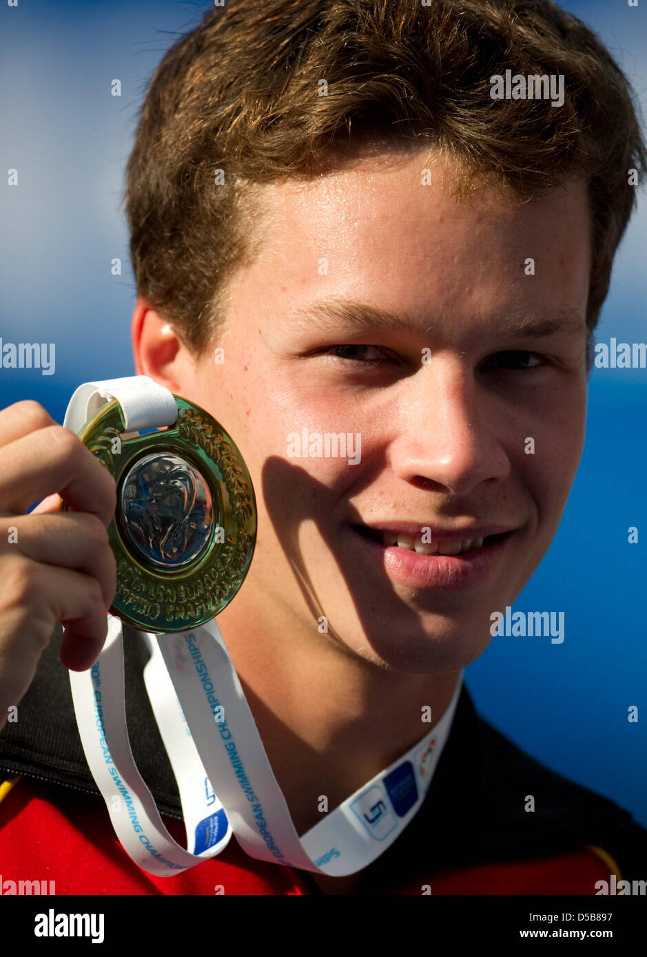German high diver Patrick Hausding shows his silver medal for high ...