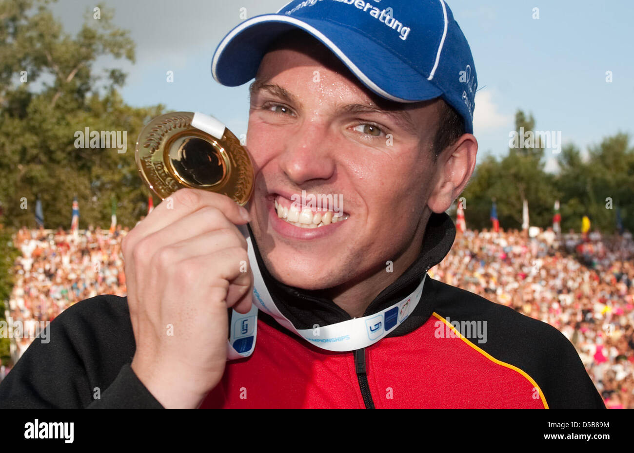 German swimmer Paul Biedermann poses with his gold medal after winning ...
