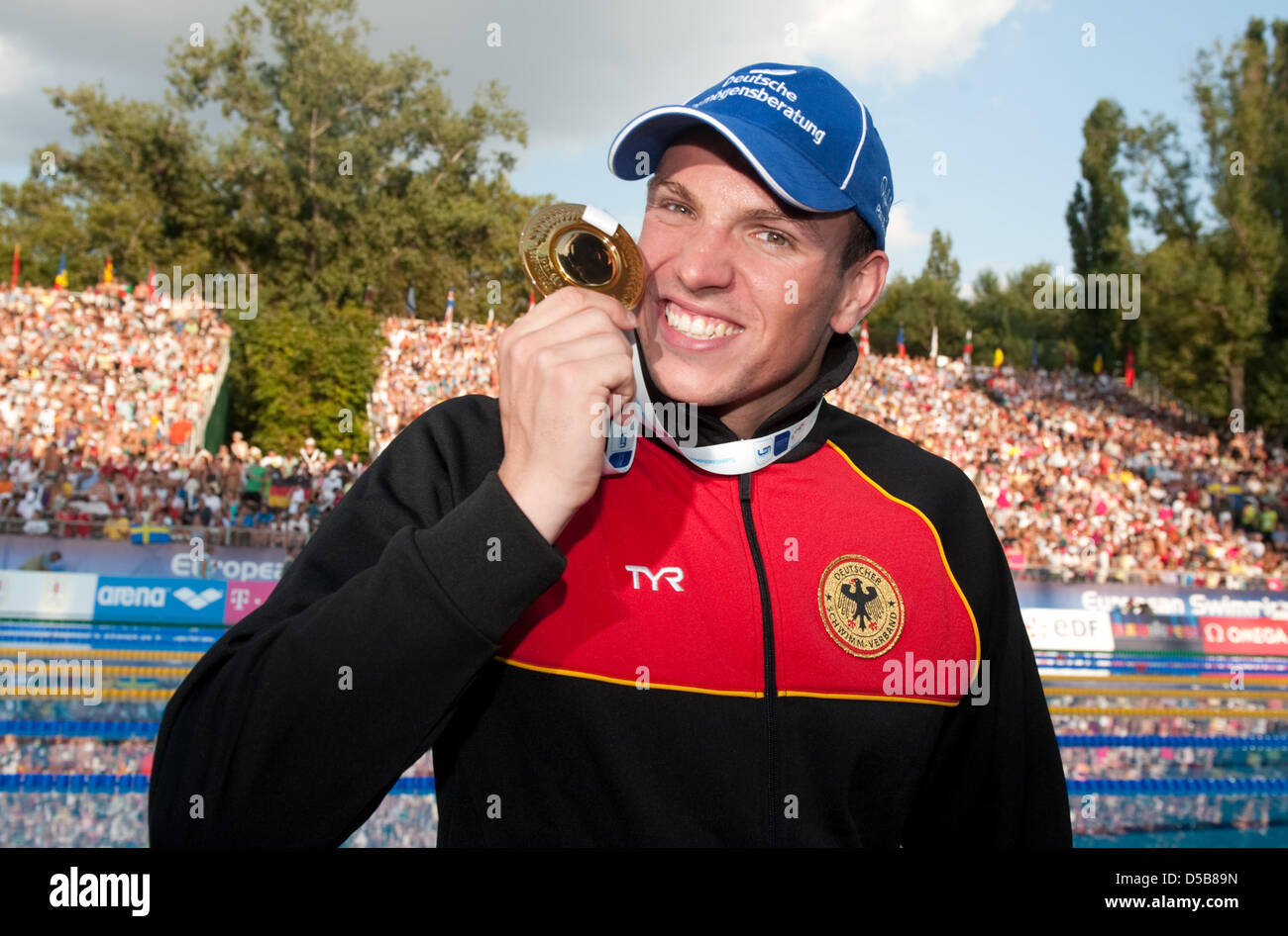 German swimmer Paul Biedermann poses with his gold medal after winning ...