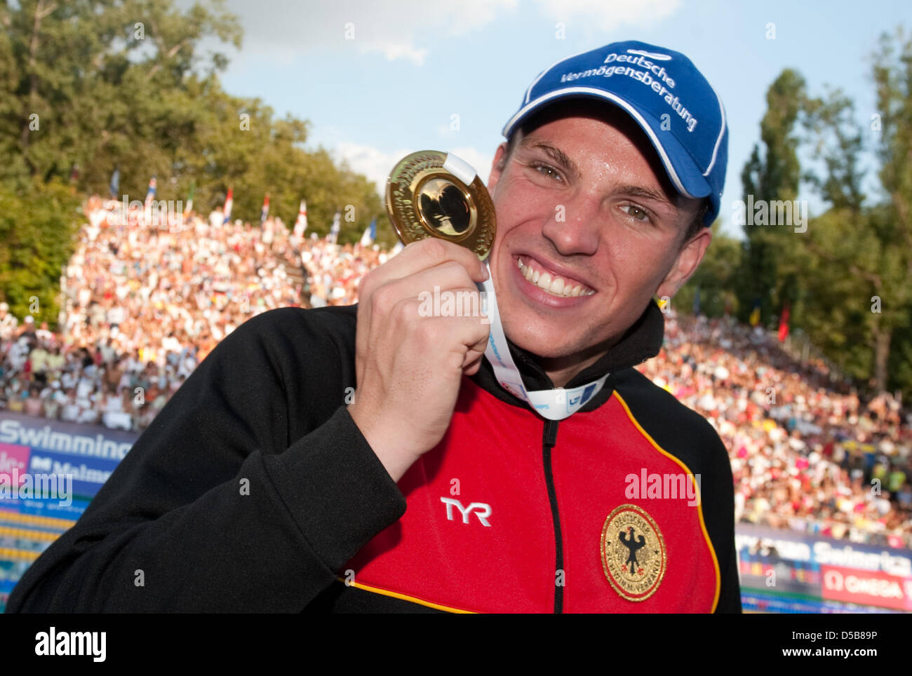 German swimmer Paul Biedermann poses with his gold medal after winning ...