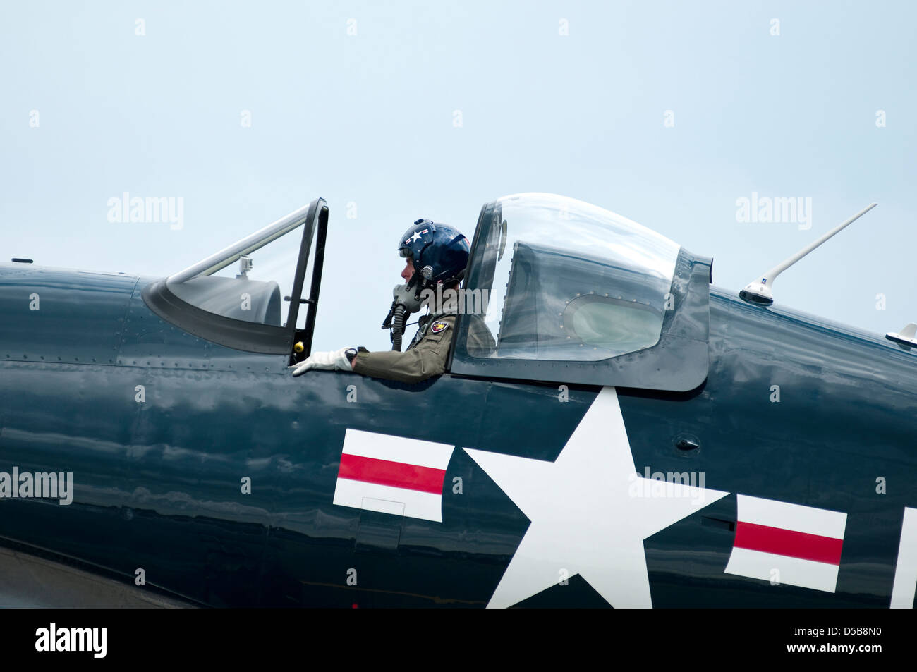 Close-up image of a pilot sitting in a vintage World war two US Navy ...