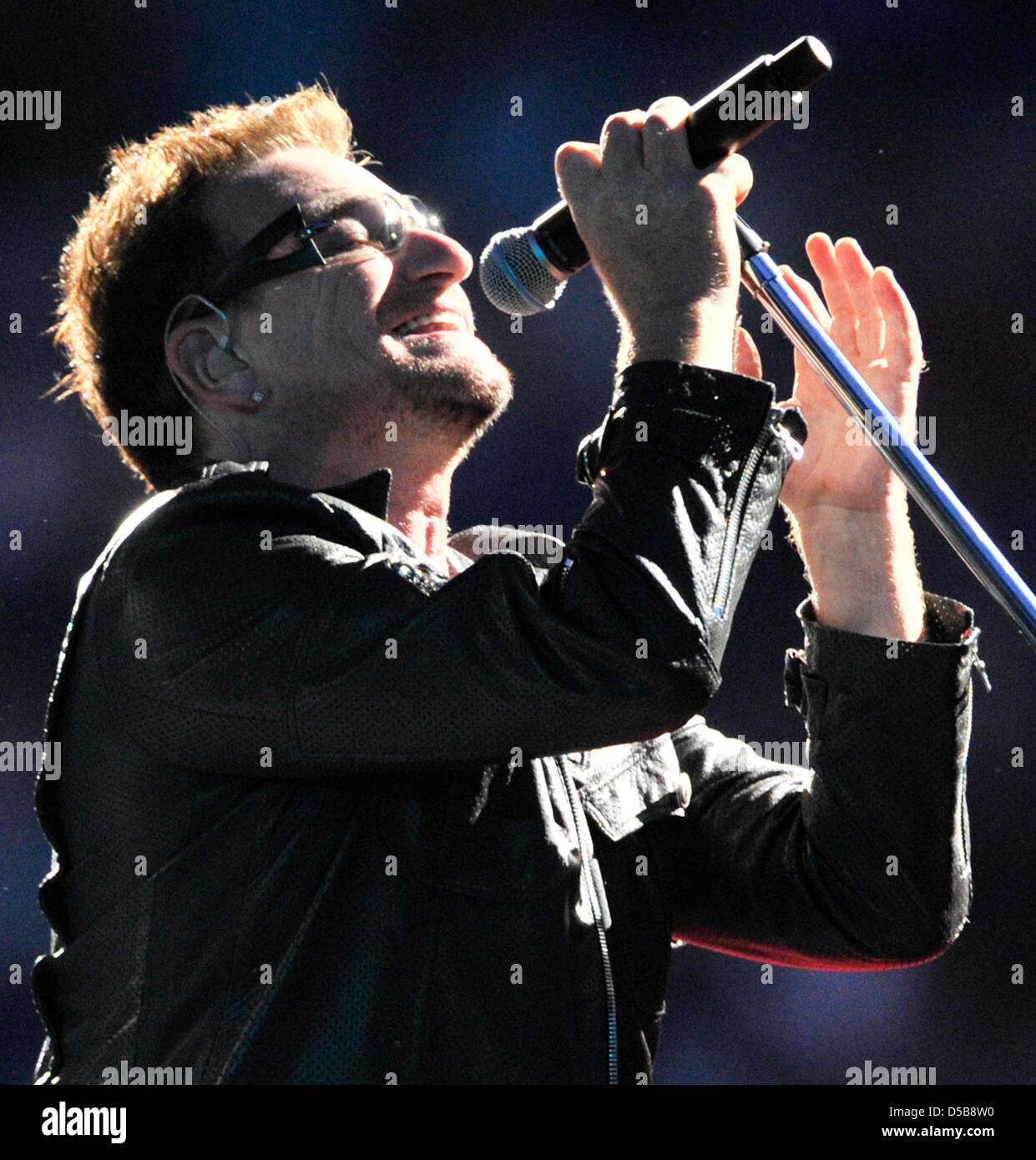Frontman Bono, of the Irish band U2, sings for 55.000 fans in the ...