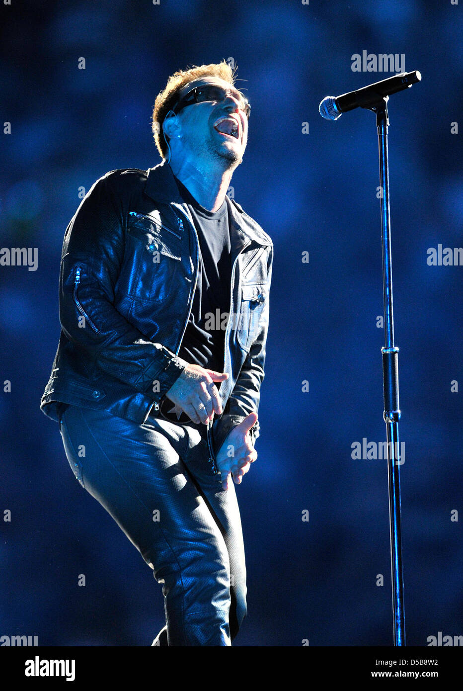Frontman Bono, of the Irish band U2, sings for 55.000 fans in the ...