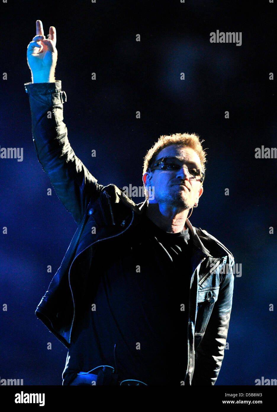Frontman Bono, of the Irish band U2, sings for 55.000 fans in the ...