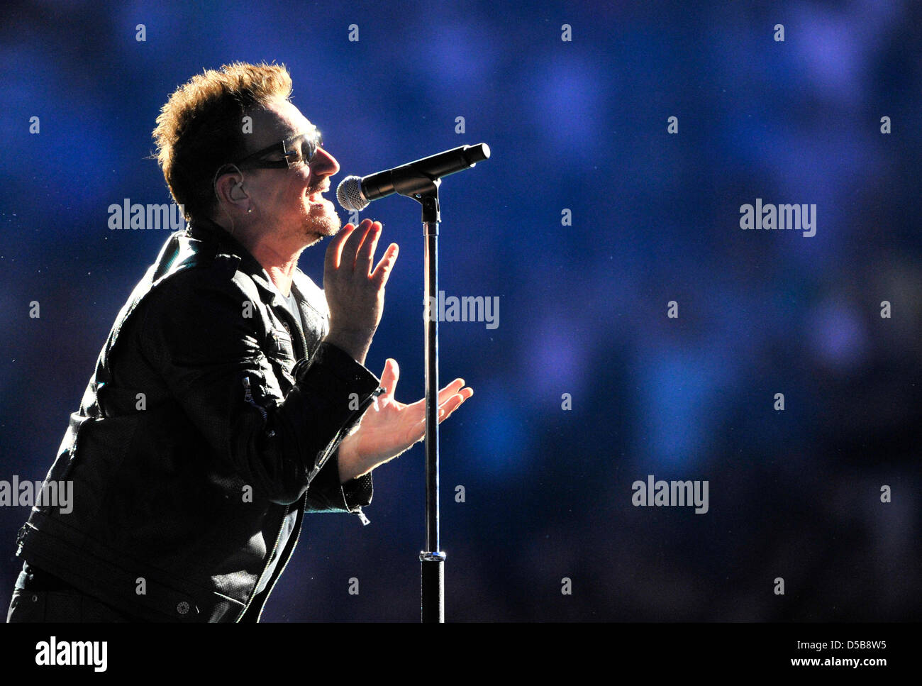 Frontman Bono, of the Irish band U2, sings for 55.000 fans in the ...
